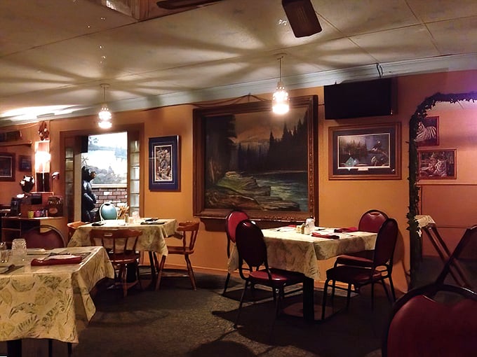 Warm lighting, northwoods-themed artwork, and tables set for memorable meals—the dining room at Dreamland embodies the supper club ethos of unhurried enjoyment.
