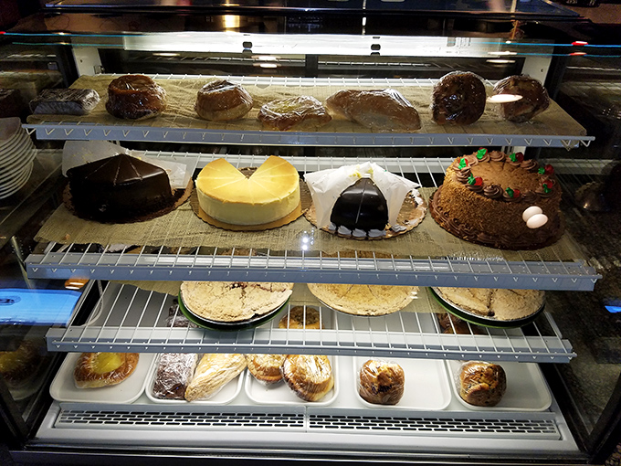 The dessert case—where willpower goes to die and "I'll just have coffee" turns into "Well, maybe just a slice" faster than you can say cheesecake.