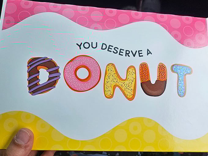 "You Deserve A Donut" might be the most honest marketing slogan ever created. A pink permission slip for indulgence we should all carry.