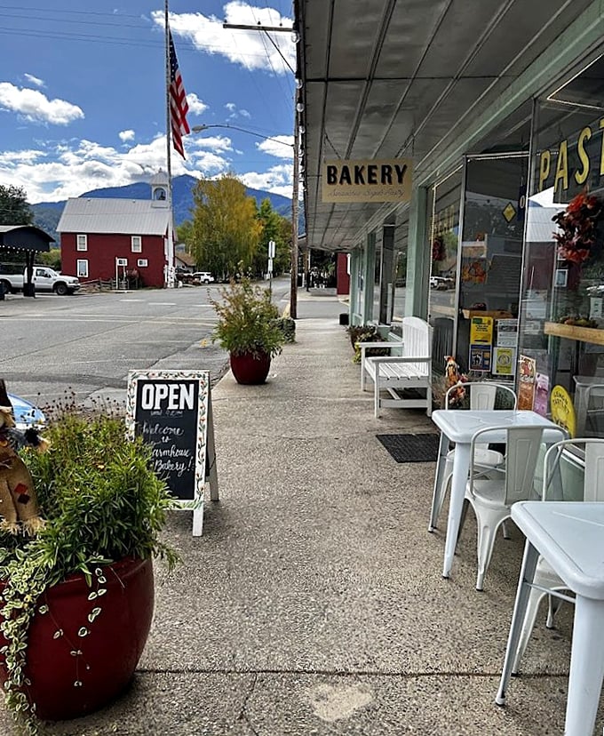 The local bakery's sidewalk seating invites you to savor pastries while mountain-watching – multitasking at its most delicious.