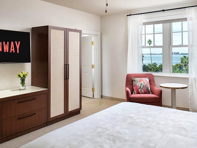 The Fenway Hotel room offers that perfect Florida view—palm trees, water, and the promise of zero morning commute.