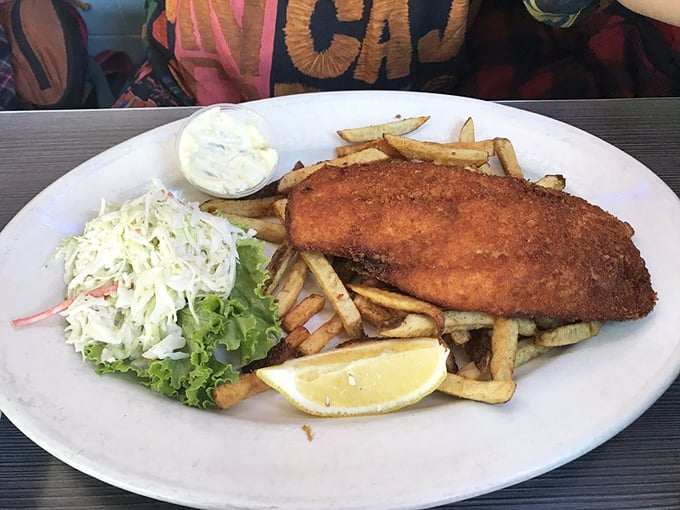 Fish and chips that would make a British pub proud, with a side of coleslaw that adds just the right amount of crunch and tang.