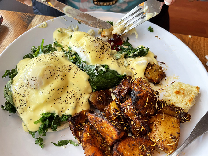 Benedict with a PhD – poached eggs lounging on a bed of greens under a hollandaise blanket that's worth setting an alarm for.