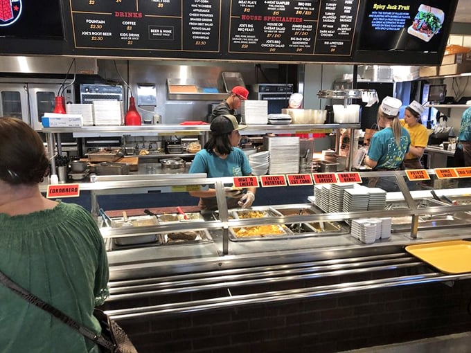 The serving line—where dreams are built one meat selection at a time. Choose wisely, though there are no wrong answers here.