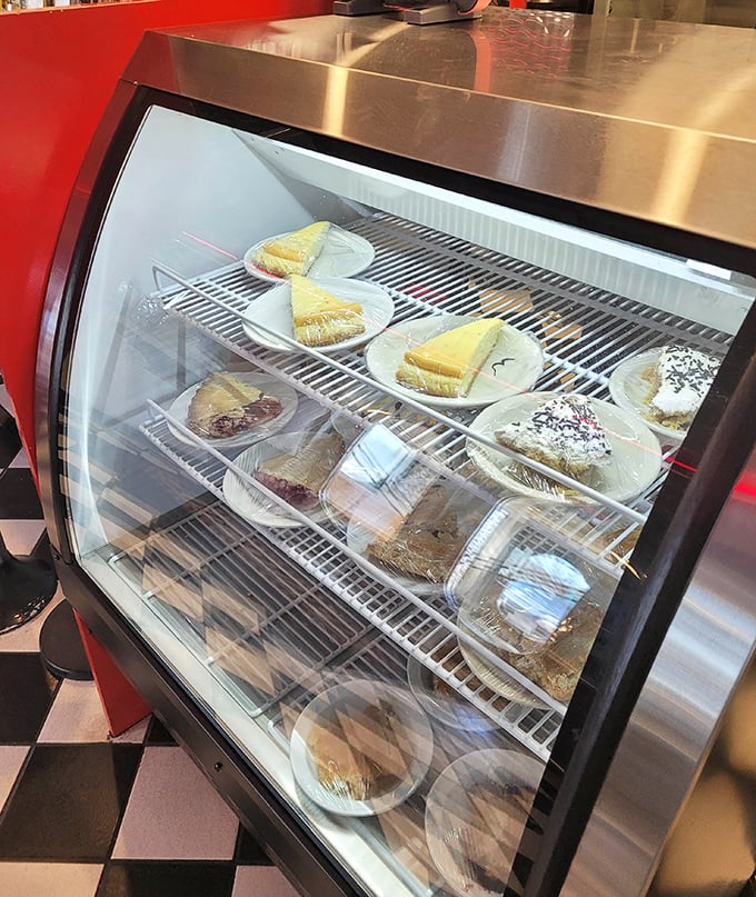 The dessert case—where willpower goes to die and diet plans are forgotten in favor of homemade pie and cake temptations.