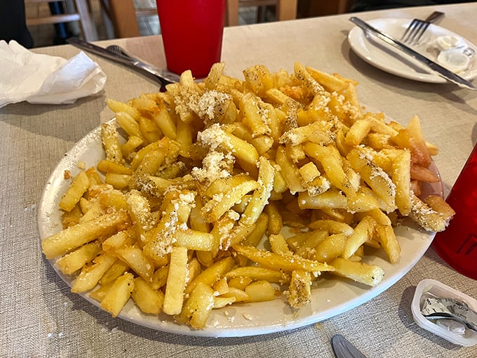 Even the french fries get the Italian treatment here, dusted with parmesan like snow on the Alps. Potato perfection that refuses to be a mere side dish.