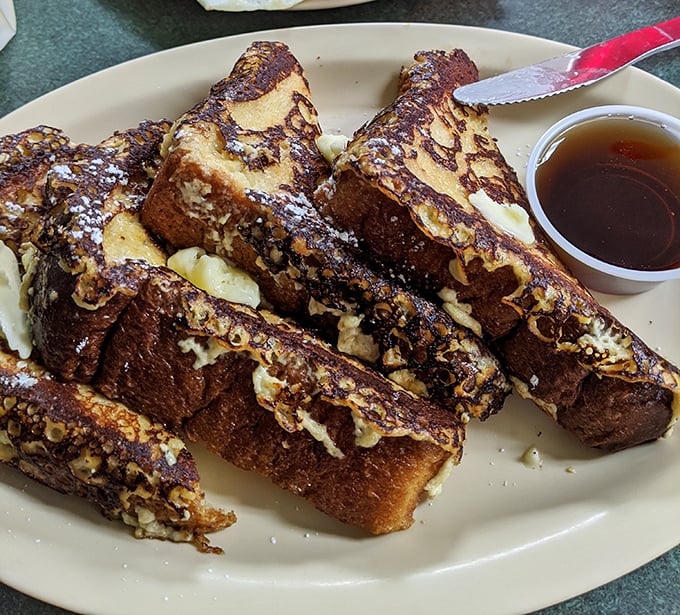 French toast that's achieved that perfect golden-brown exterior while maintaining a custardy center—the breakfast equivalent of winning the lottery. 