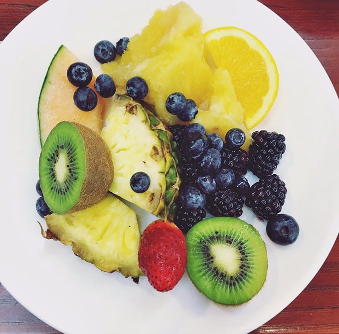 Nature's candy arranged with care—fresh berries, tropical kiwi, and pineapple that remind you why fruit deserves a place at the table beyond health considerations.
