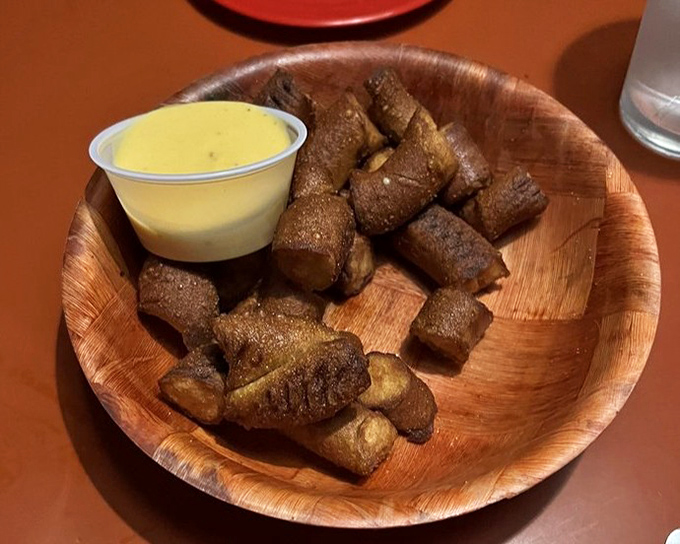 Pretzel bites that have achieved the perfect balance – crispy exterior, soft interior, and that honey mustard for the win.