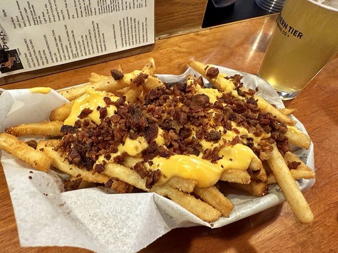 These loaded fries don't just speak—they sing. Cheese sauce and bacon bits transform humble potatoes into a main event.