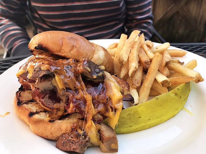 This isn't just a sandwich—it's a towering achievement of meat, cheese, and sauce that requires both hands and possibly a nap afterward.