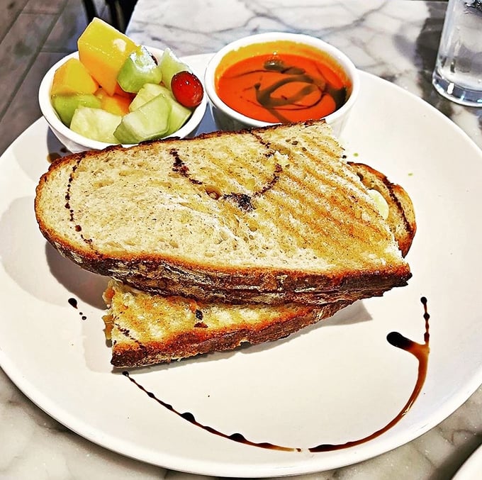 Grilled cheese elevated from childhood memory to grown-up indulgence. That tomato soup isn't just a side—it's a perfect dance partner.