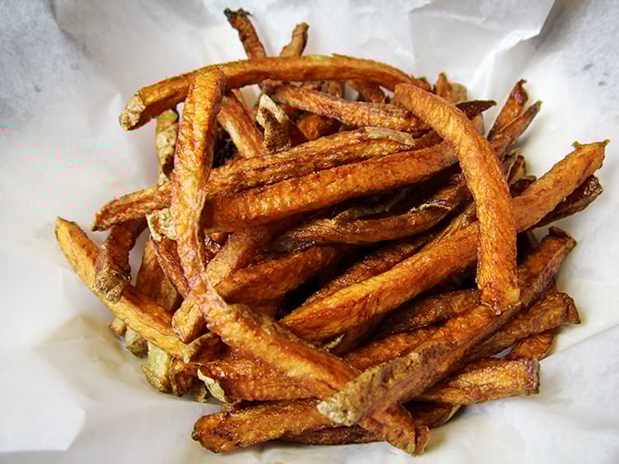 These aren't just fries – they're golden potato wands of happiness. Perfectly crisp outside, fluffy inside, and seasoned by someone who understands salt.
