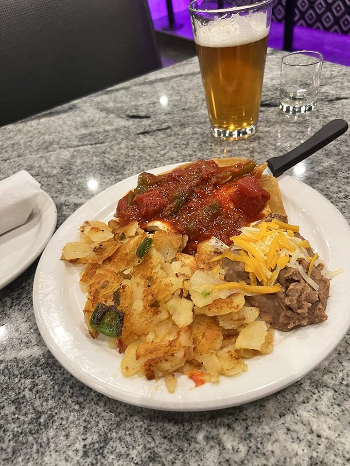 Huevos Rancheros delivering authentic Mexican comfort with beans, eggs, and tortillas in perfect harmony.