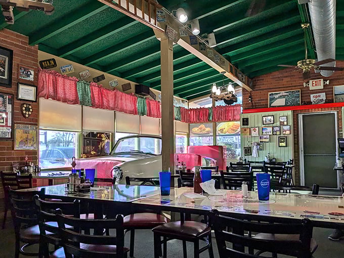 Green ceiling beams, license plates, and red curtains create the kind of authentic diner atmosphere money can't buy but memories are made of.