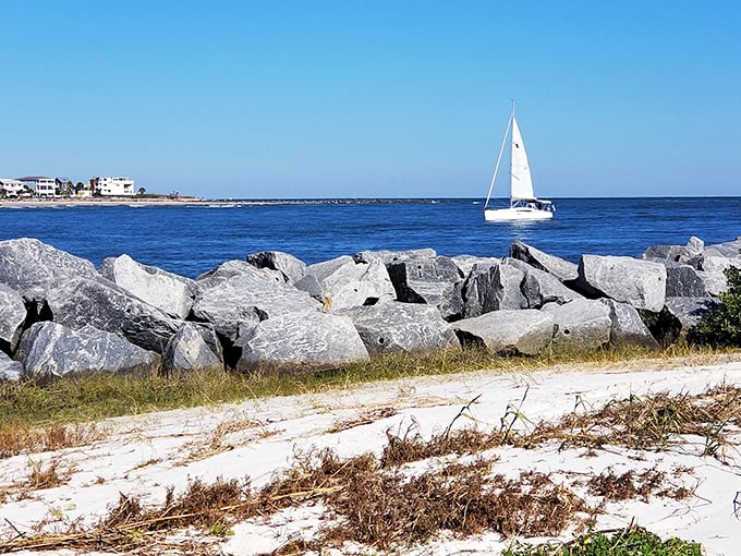 Where land meets sea in a dramatic rocky finale – with sailboats providing the perfect moving scenery for your beachside daydreams.