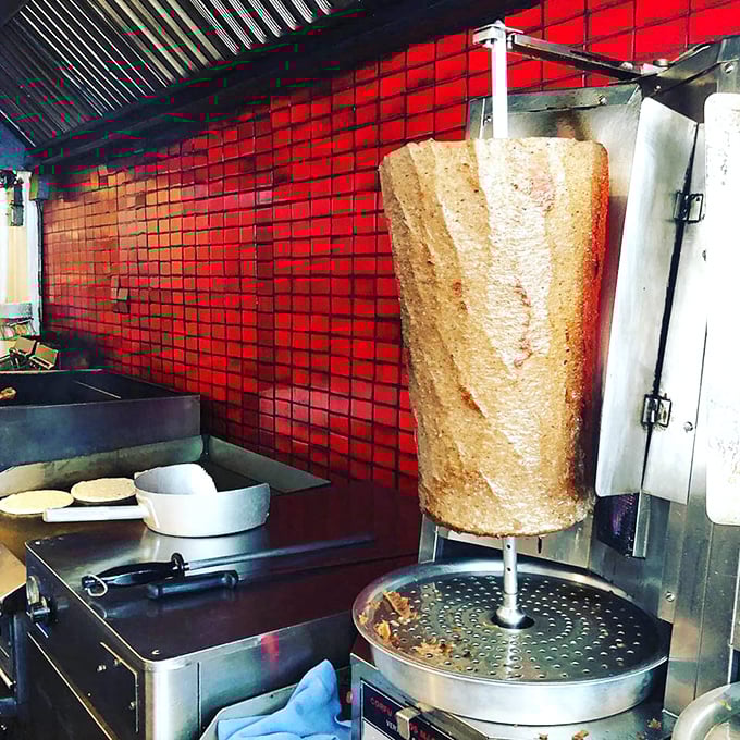 That vertical spit of gyro meat isn't just cooking—it's performing a slow, mesmerizing dance of flavor development before your eyes.