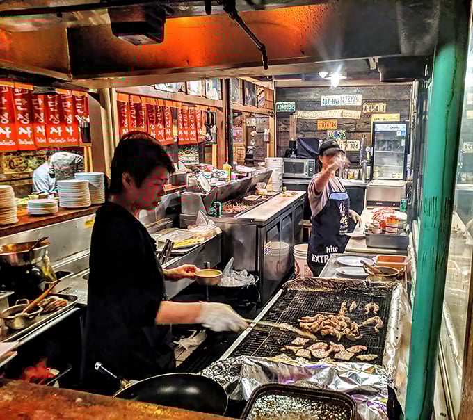 Where the magic happens – watching these cooks navigate their tight quarters is like witnessing a perfectly choreographed dance of fire and flavor.