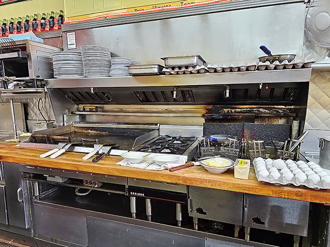 The battle station where breakfast dreams come true—a well-worn grill that's seen more action than a Hollywood stuntman and twice the character. 