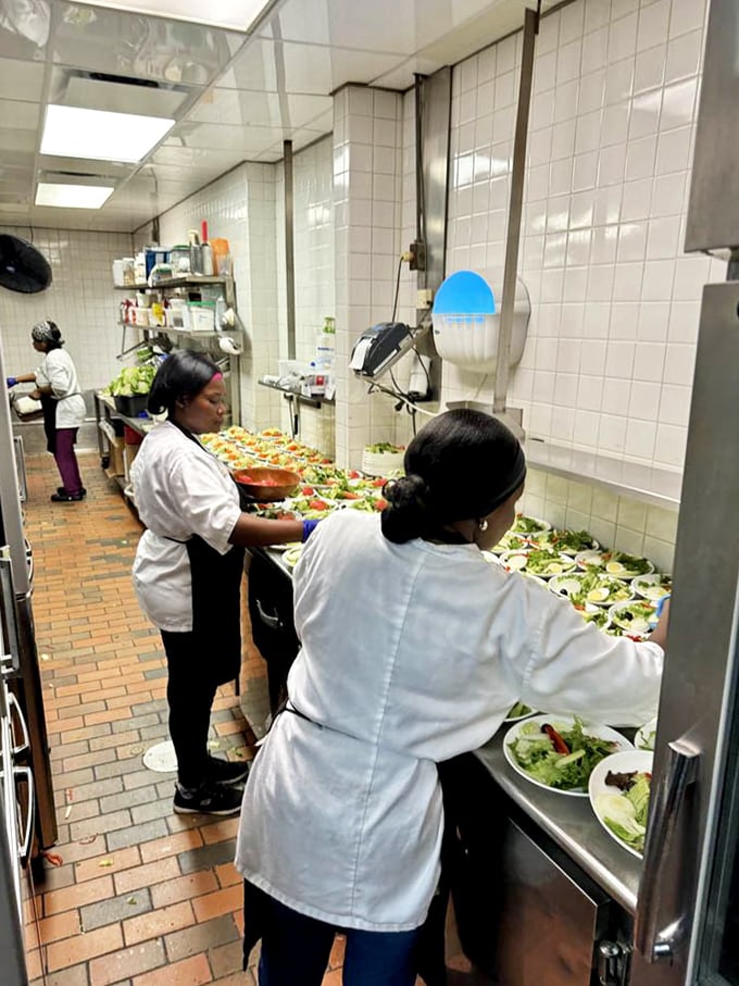 The kitchen salad station reveals the unsung heroes of fine dining—artists whose canvas is romaine and whose medium is impeccably fresh ingredients.