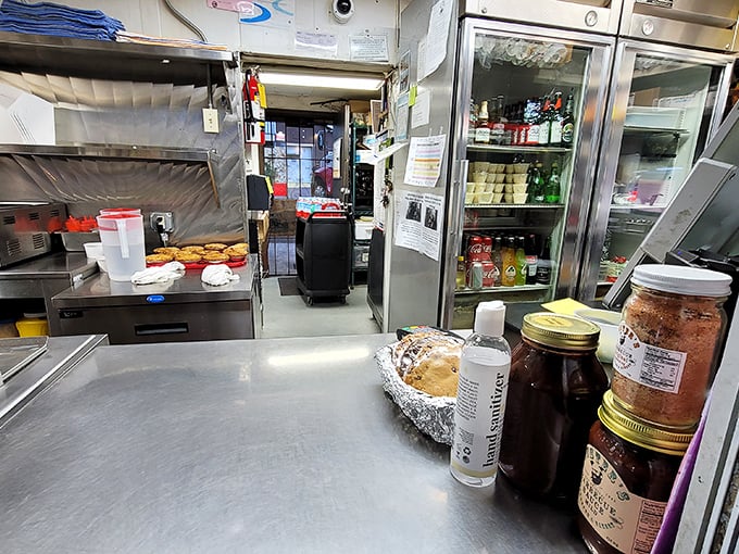 The kitchen – not fancy, not pretentious, just the essential tools needed to transform meat and smoke into memories. Barbecue alchemy at its finest.