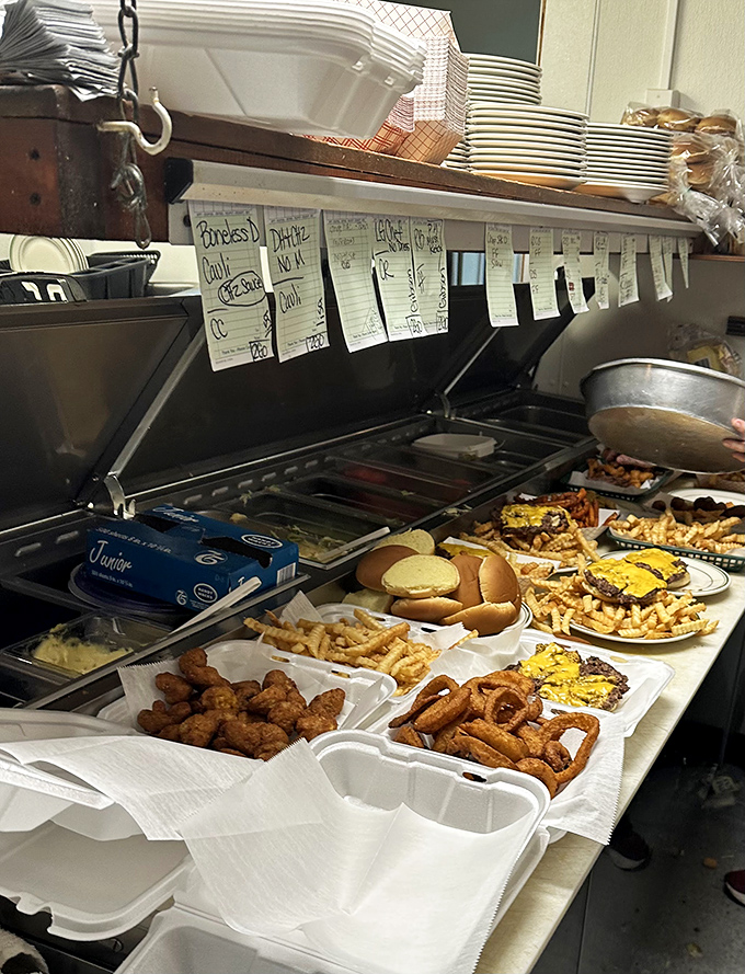 A glimpse into the kitchen reveals the organized chaos where Rod's magic happens—handwritten tickets and plates ready for hungry patrons.