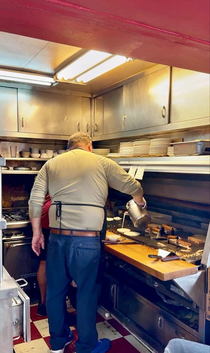The wizard behind the curtain, creating breakfast magic on a well-seasoned grill. Some heroes wear aprons, not capes.