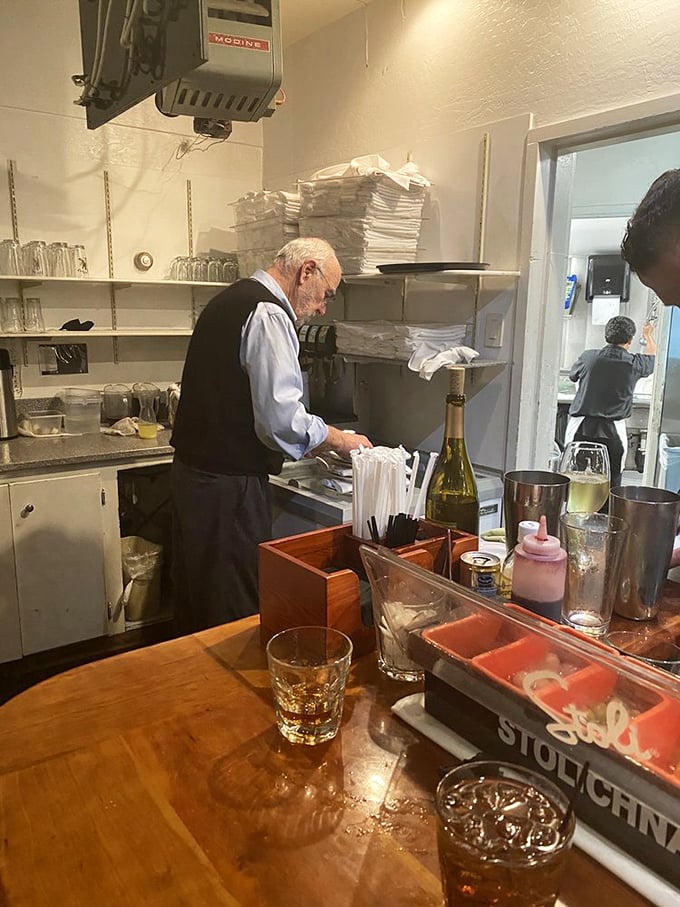 Behind every great restaurant is a dedicated team. This kitchen wizard transforms fresh catches into the dishes that keep locals coming back.