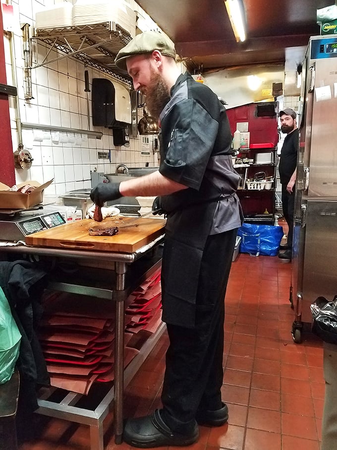Behind the scenes magic where smoke meets meat. The kitchen at Mike's is where patience transforms into flavor.