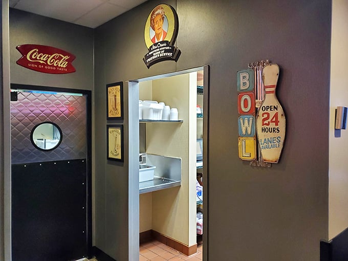 Even the kitchen entrance gets the nostalgic treatment with vintage signs. That "BOWL" sign isn't just decoration—it's a command I fully intend to obey.