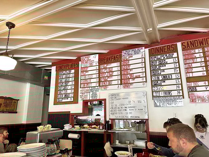 The menu board wall—a masterclass in hand-lettering and the art of making impossible breakfast decisions before coffee kicks in.