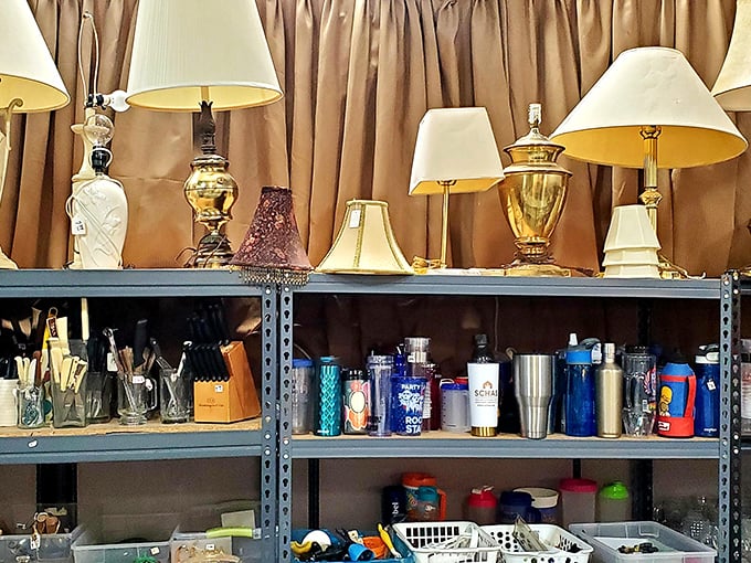 Lamps above, travel mugs below—the thrifter's version of "business up top, party on the bottom."