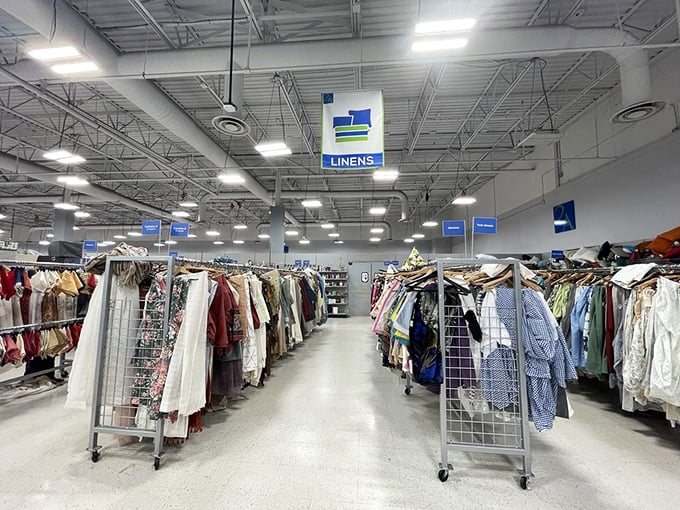 The linens aisle – where tablecloths from dinner parties past and curtains from redecorated living rooms await their second act.