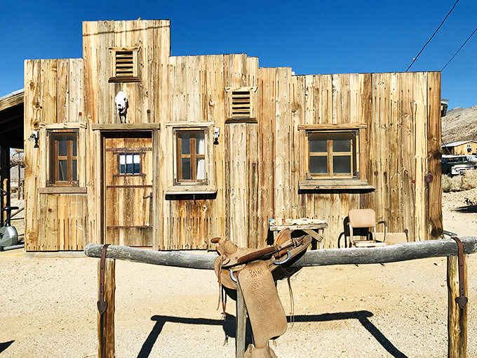 Weathered wood that's seen more California history than most textbooks. That saddle isn't decorative—it's transportation backup.