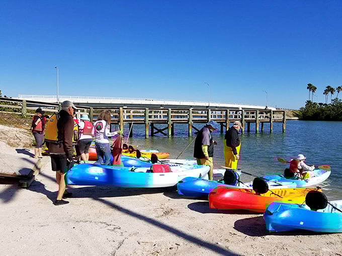 Colorful kayaks await adventure at Little Jim Bridge Park – floating chariots ready to transport explorers through Fort Pierce's aquatic wonderland.
