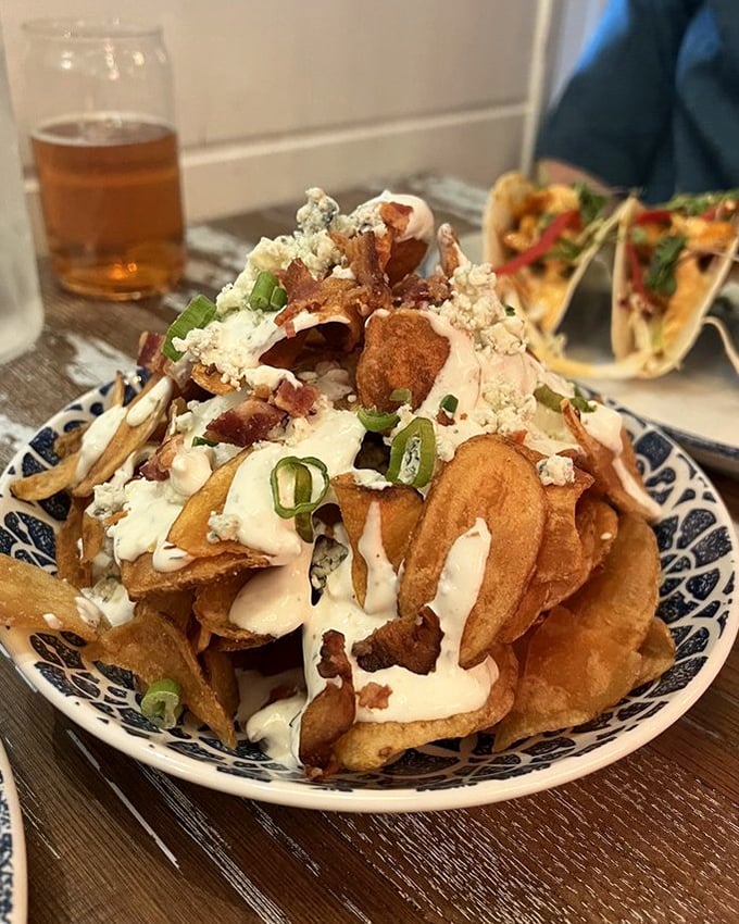 These loaded chips aren't just a snack—they're an architectural achievement of crispy, creamy, and savory that demands to be shared (but you won't want to).