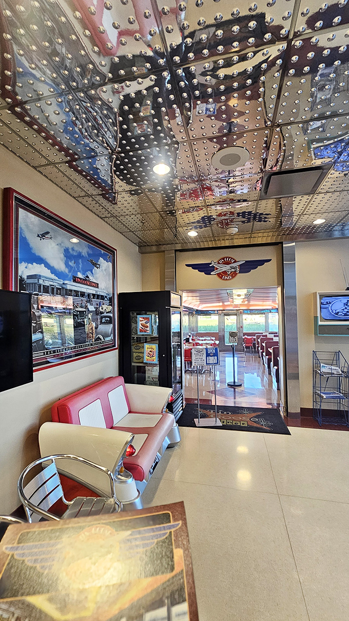 The entryway features aviation-themed décor and a riveted metal ceiling that makes you feel like you're boarding a luxury aircraft from the 1940s.