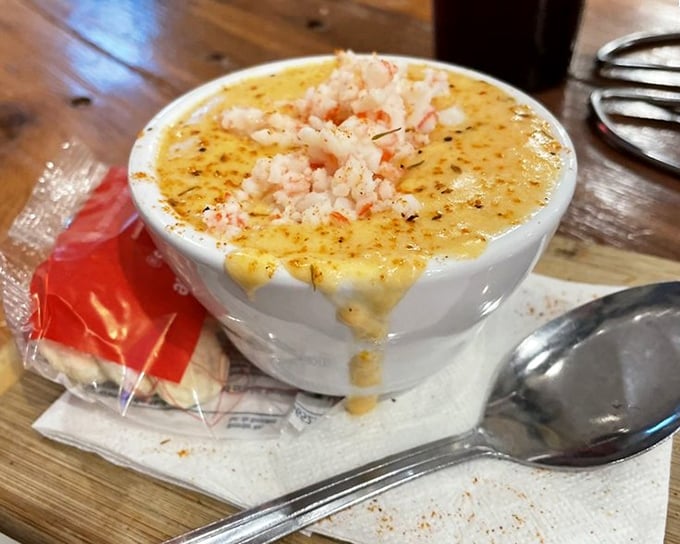 This lobster bisque isn't just soup – it's a warm, creamy hug from the ocean, topped with tender morsels of its main attraction.