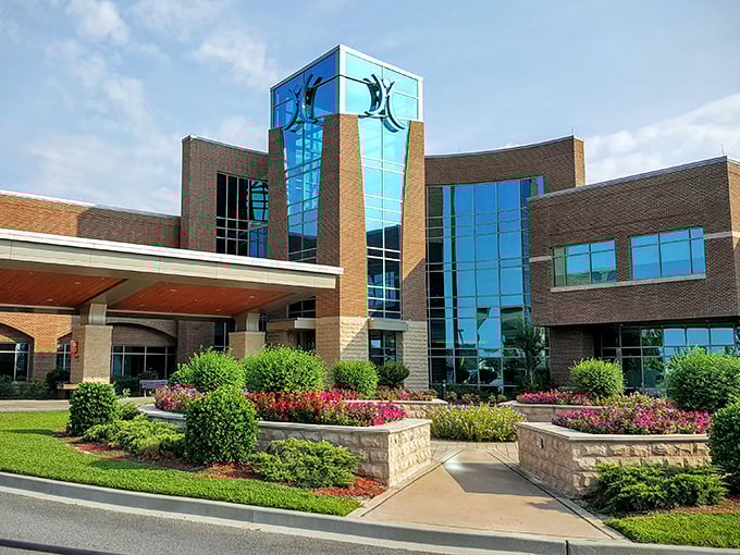 Memorial Health Meadows Hospital combines modern healthcare with architectural flair, its blue-glass tower reflecting Georgia skies above manicured gardens.