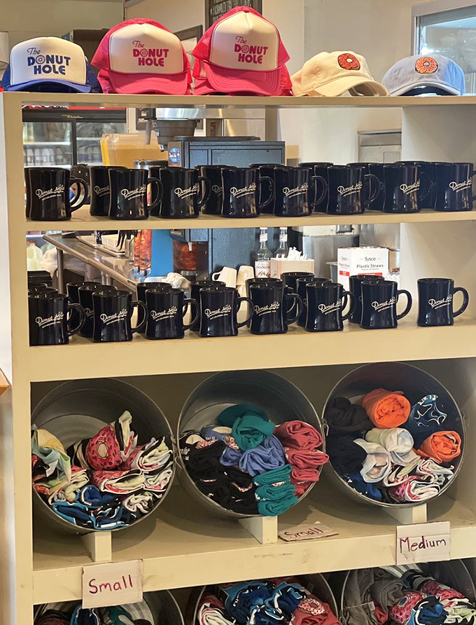 Merchandise that lets you take home the memory, if not the biscuits. Those blue mugs have probably witnessed more morning revelations than therapists. 
