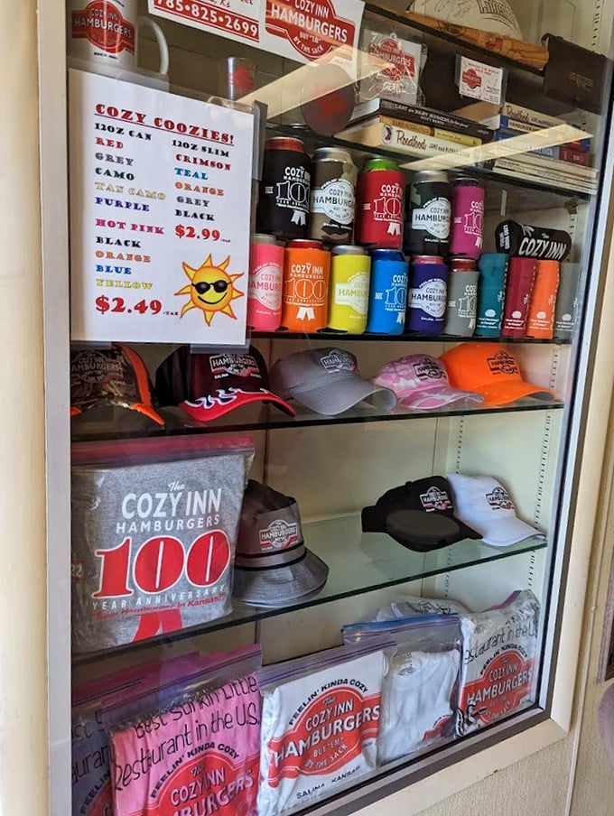 The merchandise wall proves people don't just want to eat these burgers—they want to wear their allegiance on their sleeves (and koozies).