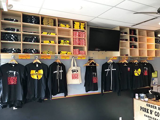 The merchandise wall isn't just swag—it's a chance to take the Saddleback experience home, minus the smoker and years of pitmaster expertise.