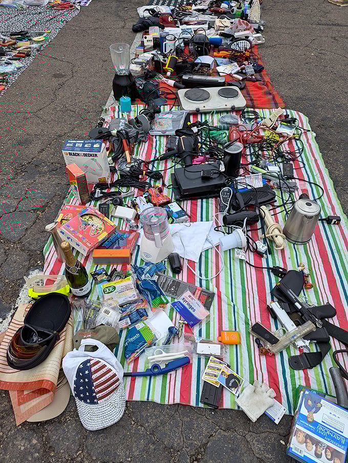 The ultimate garage sale tableau—where blenders meet board games and yesterday's gadgets await their second chance at usefulness.