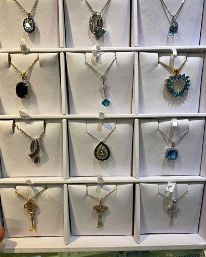 Jewelry displayed with the care of a fine boutique but priced for mere mortals—each necklace promising to be that conversation piece you've been searching for.
