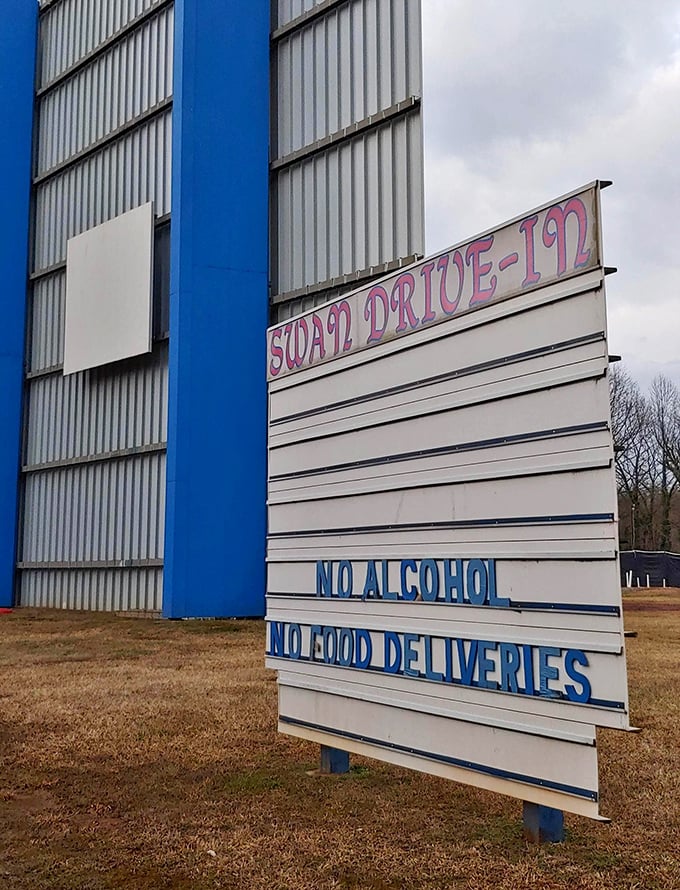 House rules spelled out in blue and white—a gentle reminder that some traditions, like enjoying movies without alcohol, never go out of style.