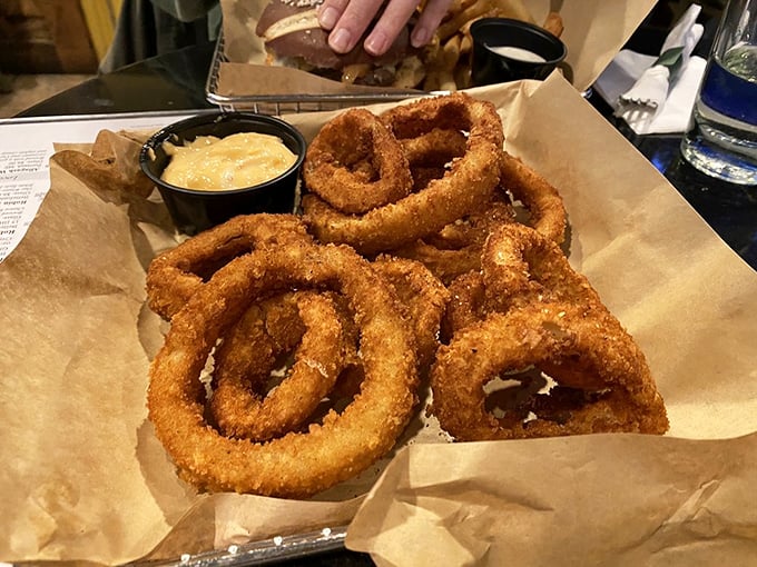 Onion rings with the perfect crunch-to-softness ratio. That dipping sauce is standing by, ready to elevate the experience to religious territory.