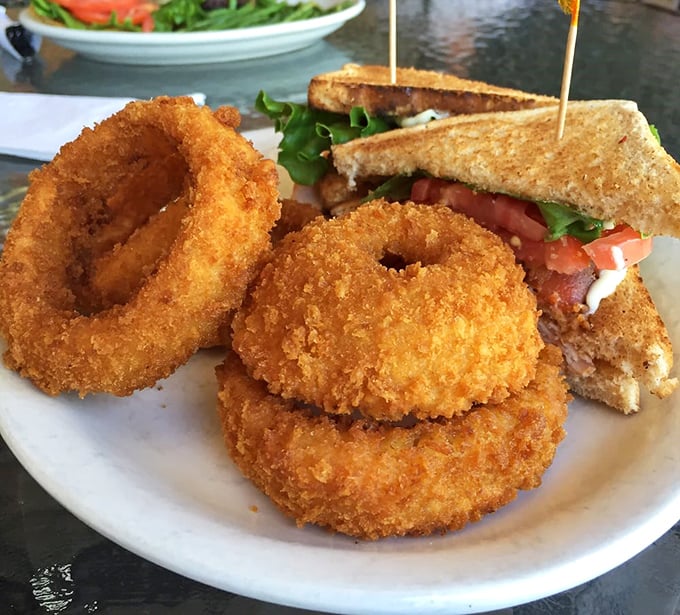 Onion rings with the perfect crunch-to-give ratio—the kind that make a satisfying sound when bitten into. Sandwich looking equally impressive.
