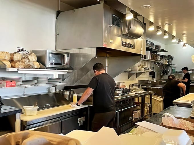 The open kitchen reveals the choreography behind your breakfast—skilled hands transforming simple ingredients into morning masterpieces.