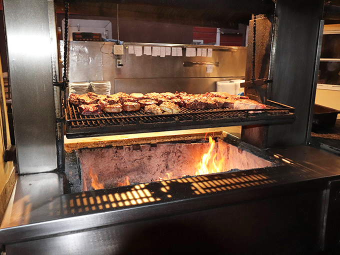 The sacred flames where magic happens. This isn't cooking—it's a ritual that transforms good meat into unforgettable experiences.