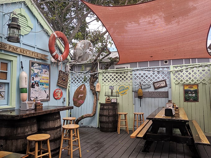 Under a coral-colored canopy, this outdoor space captures the essence of Keys dining—casual, breezy, and utterly perfect.